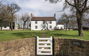 Stay warm and dry with an equestrian property complete with an American ...