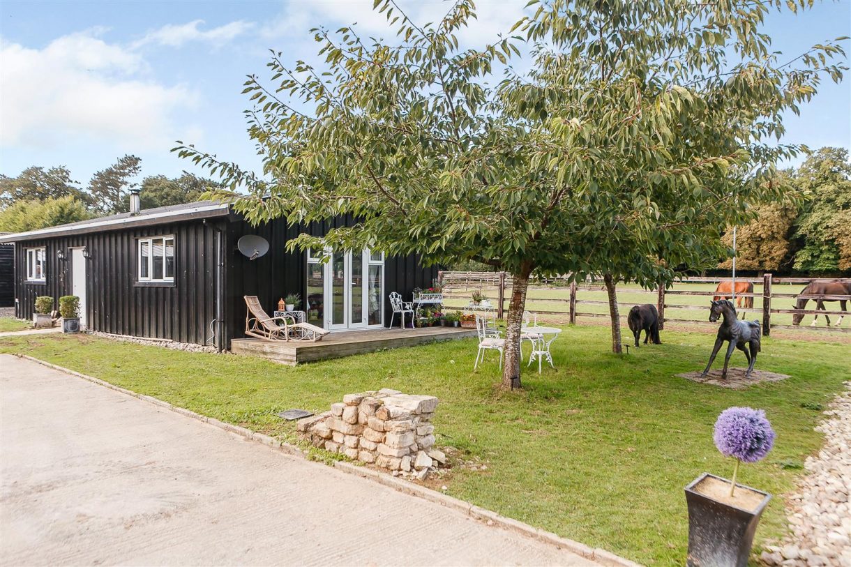 What a beauty! A countryside nest with 10 stables, 8 acres, wash bay ...
