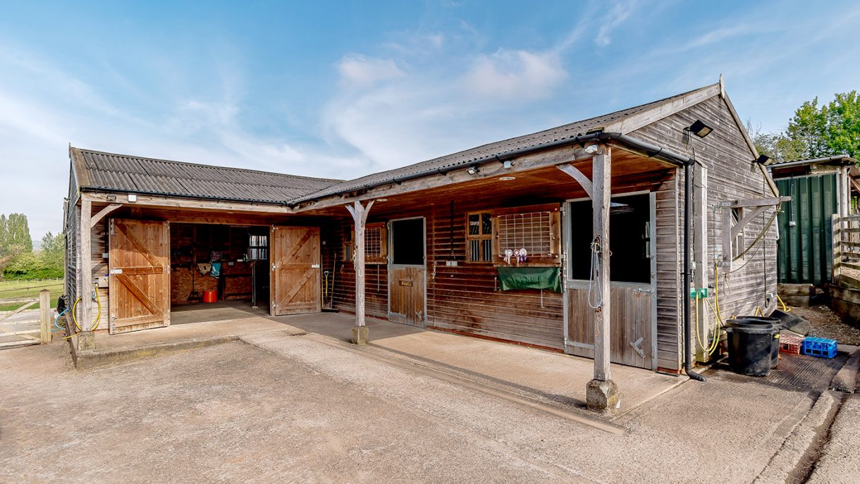 Check out this six-bedroom home with stables, arena and swimming pool ...