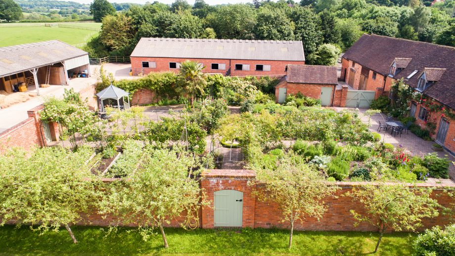 A sprawling countryside set-up, complete with 12 stables, outdoor arena ...