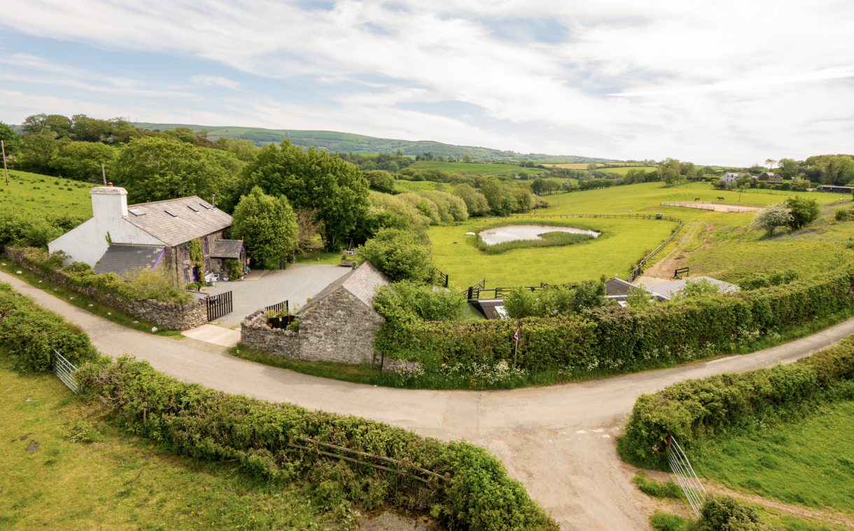 Check out this charming nine-acre property with three stables and an ...