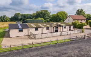 Make a home for life out of this farmhouse complete with 10 stables ...