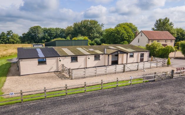 Make a home for life out of this farmhouse complete with 10 stables ...