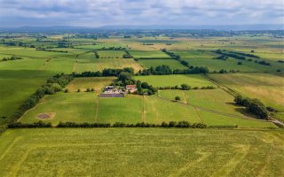 Make a home for life out of this farmhouse complete with 10 stables ...