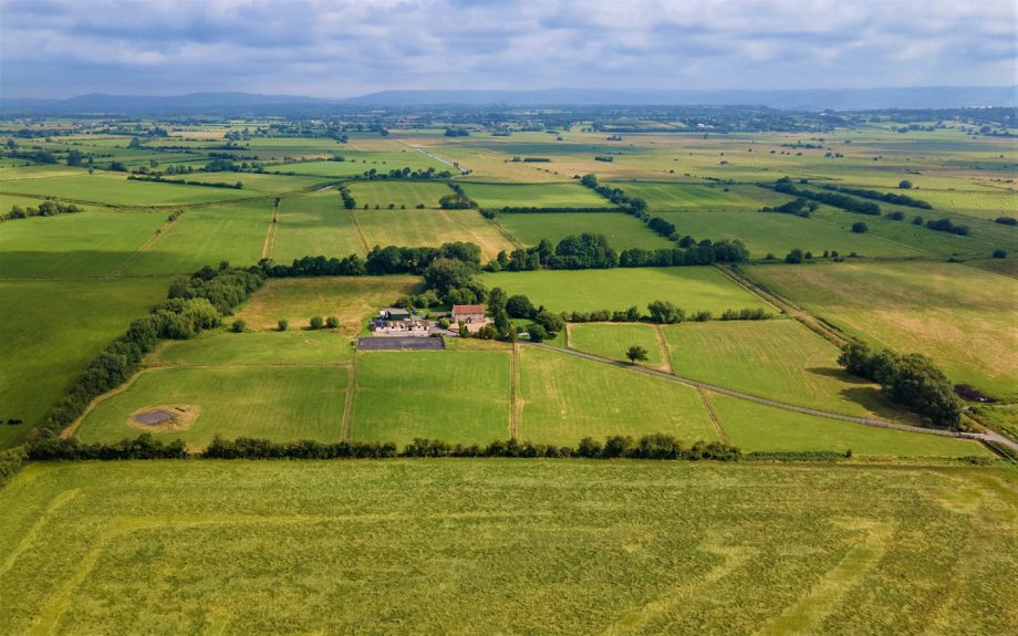 Make a home for life out of this farmhouse complete with 10 stables ...