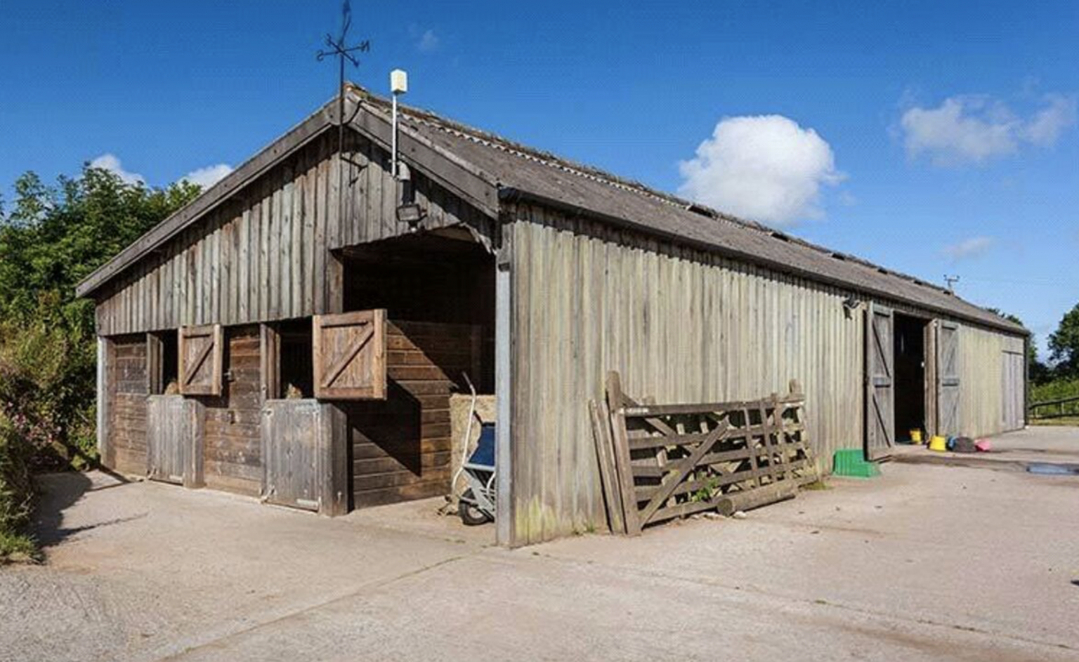 Settle into this equestrian property with up to 88 acres, stables, an ...