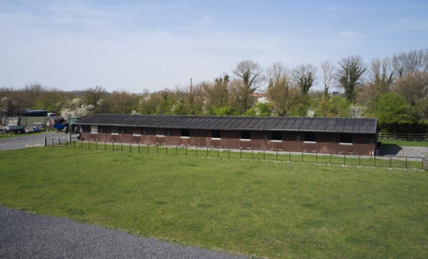 Check out this equestrian centre with 2 arenas, 44 stables and 2 homes ...