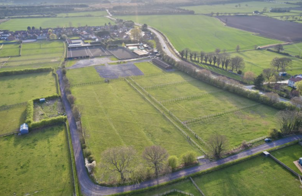 Check out this equestrian centre with 2 arenas, 44 stables and 2 homes ...