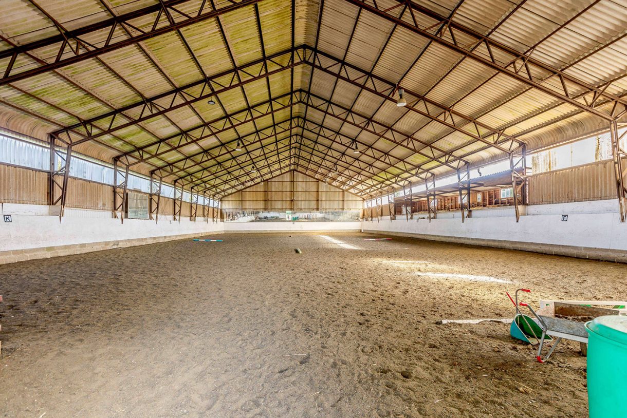 A beautiful farm – with 15 stables, 34 acres, two arenas and two extra ...