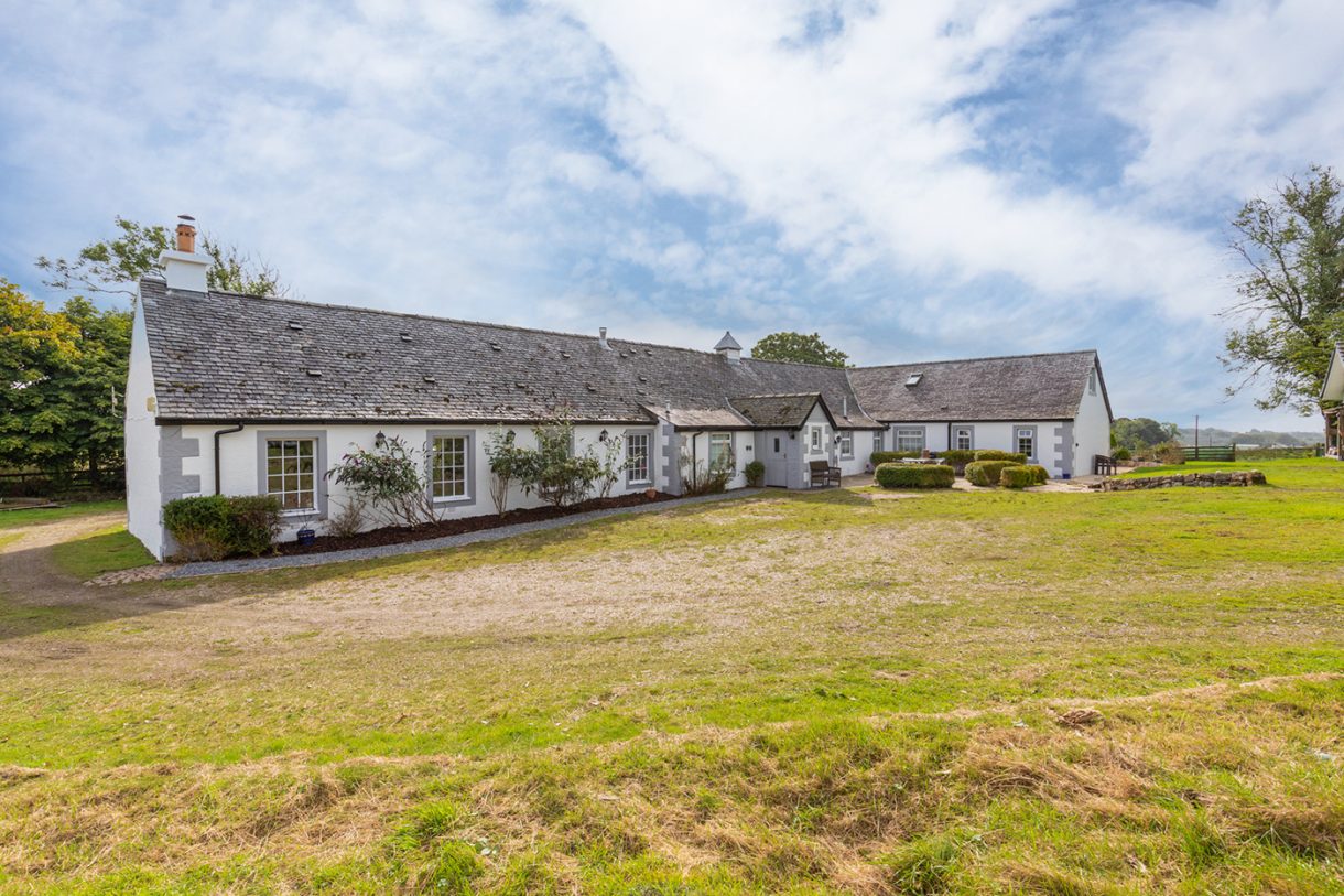 A traditional farmhouse with lots of land, two stables and outdoor ...