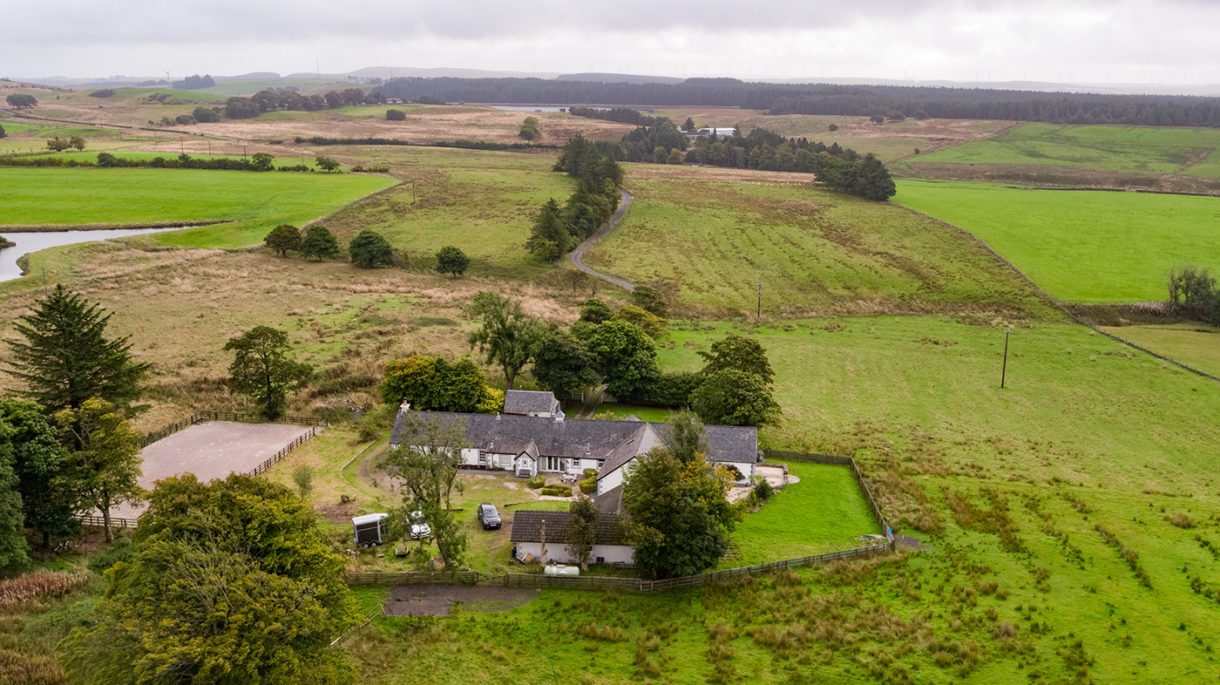 A traditional farmhouse with lots of land, two stables and outdoor ...