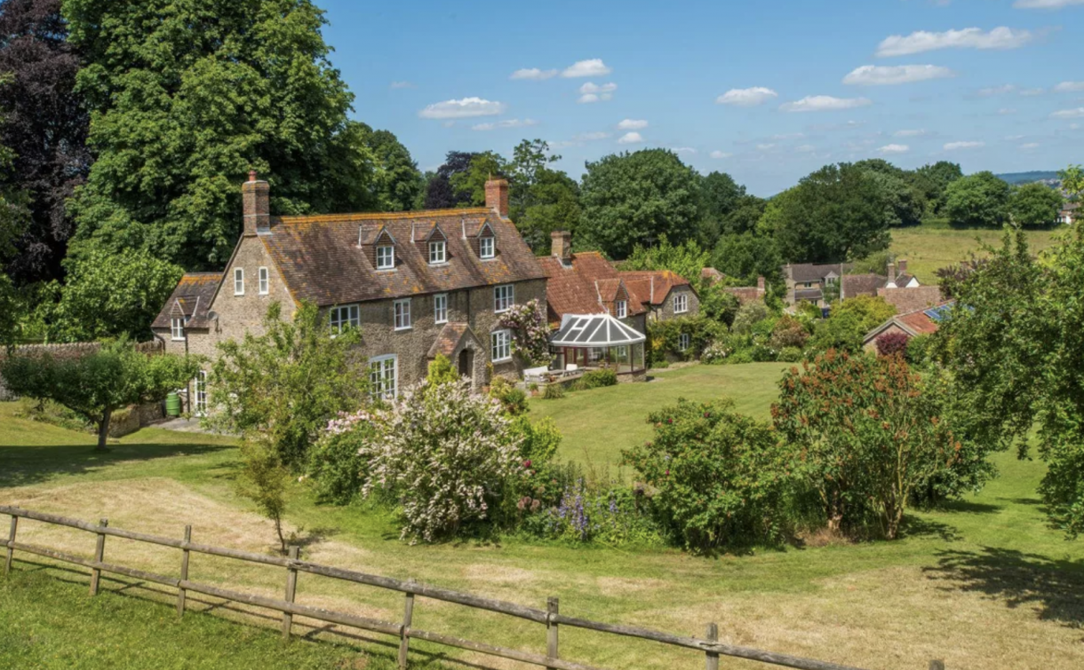 Take a look around this farmhouse set in +14 acres with 7 stables and a ...