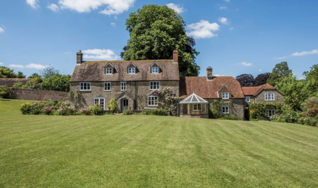 Take a look around this farmhouse set in +14 acres with 7 stables and a ...