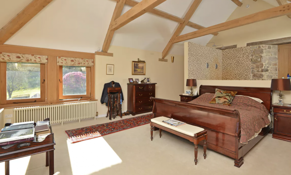 A 30-acre estate with Victorian-style stables, two arenas, guest ...