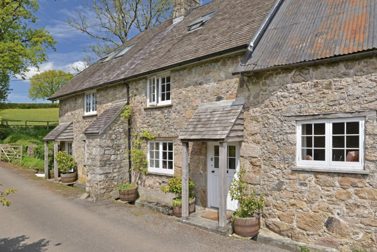 A 30-acre estate with Victorian-style stables, two arenas, guest ...