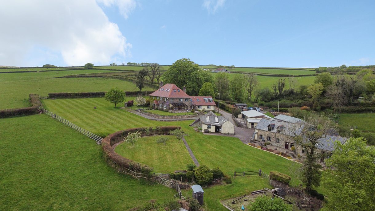 Fall in love with this 7-bedroom house with 7 stables, over 53 acres ...