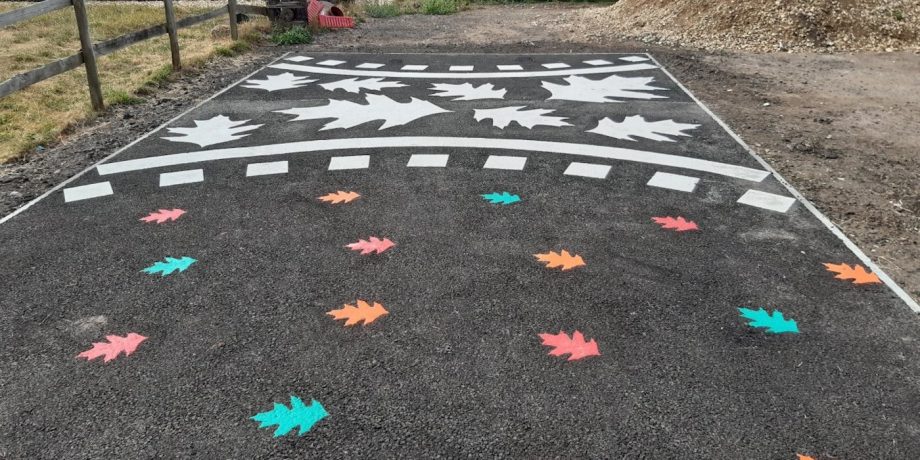 Riders prepare for new road design with innovative painted piece of ...