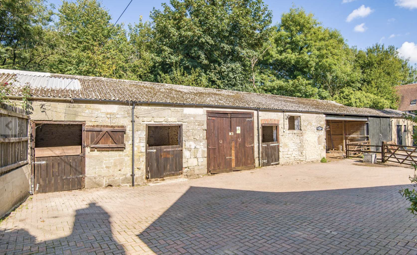 A slice of horsey heaven complete with stables, grazing and an arena ...