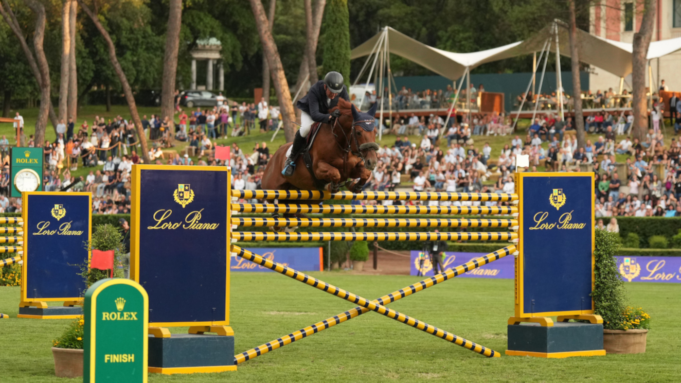 John Whitaker clears 1.95m to win six-bar challenge on 'borrowed' horse