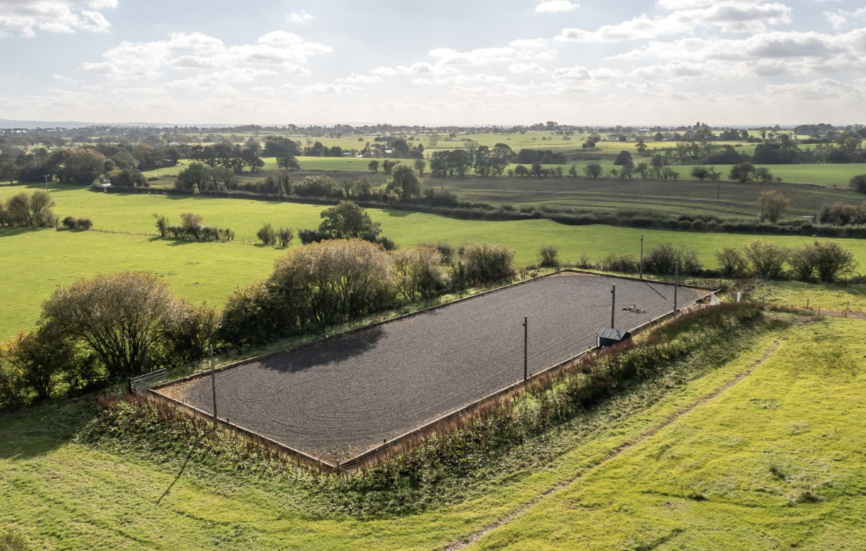 A farm located in a desirable location with stables, arena and stunning ...