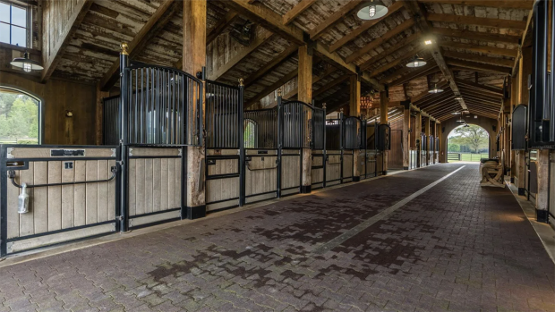 Buy a 54-acre estate complete with 3 arenas, 12 stables and a pet ...