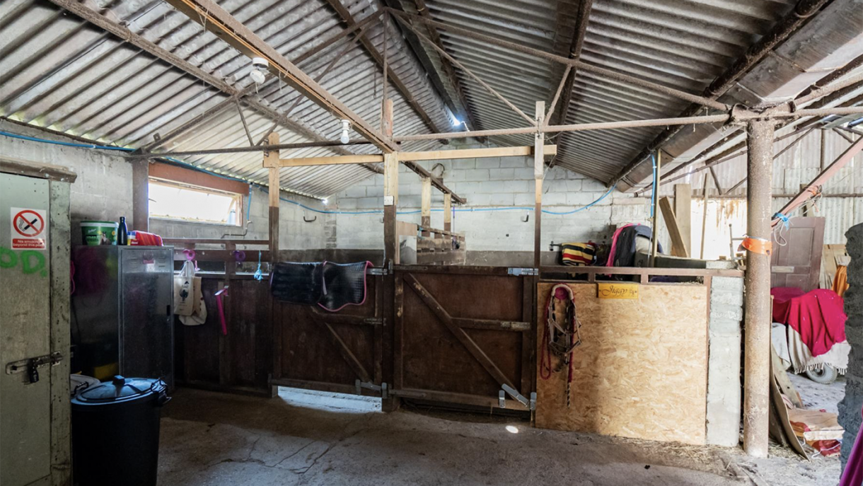 A barn conversion next to the beach with two stables and over 13 acres ...