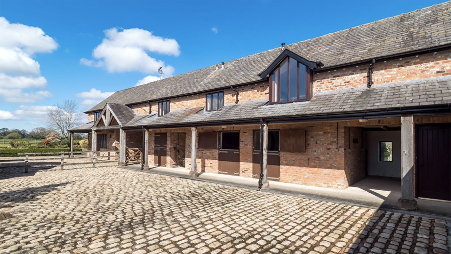 A small estate with nine stables, outdoor school, tennis court, a small ...