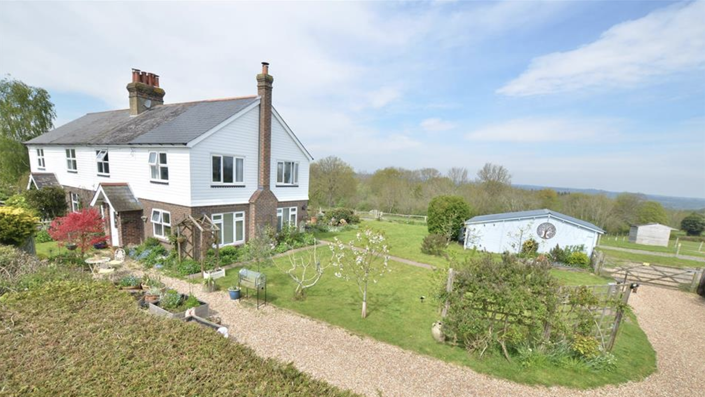 Move into this cottage with stables, arena, studio, gym, over 10 acres ...