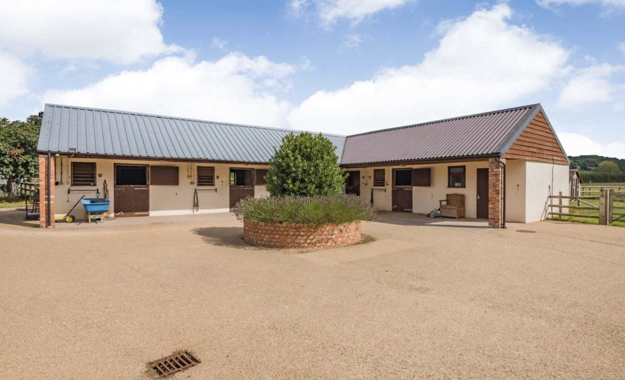 A stone-built family home with six smart stables and outdoor arena in ...