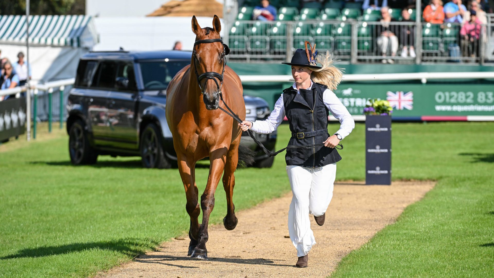 Burghley Horse Trials trot-up photos: a turquoise suit and orange shorts