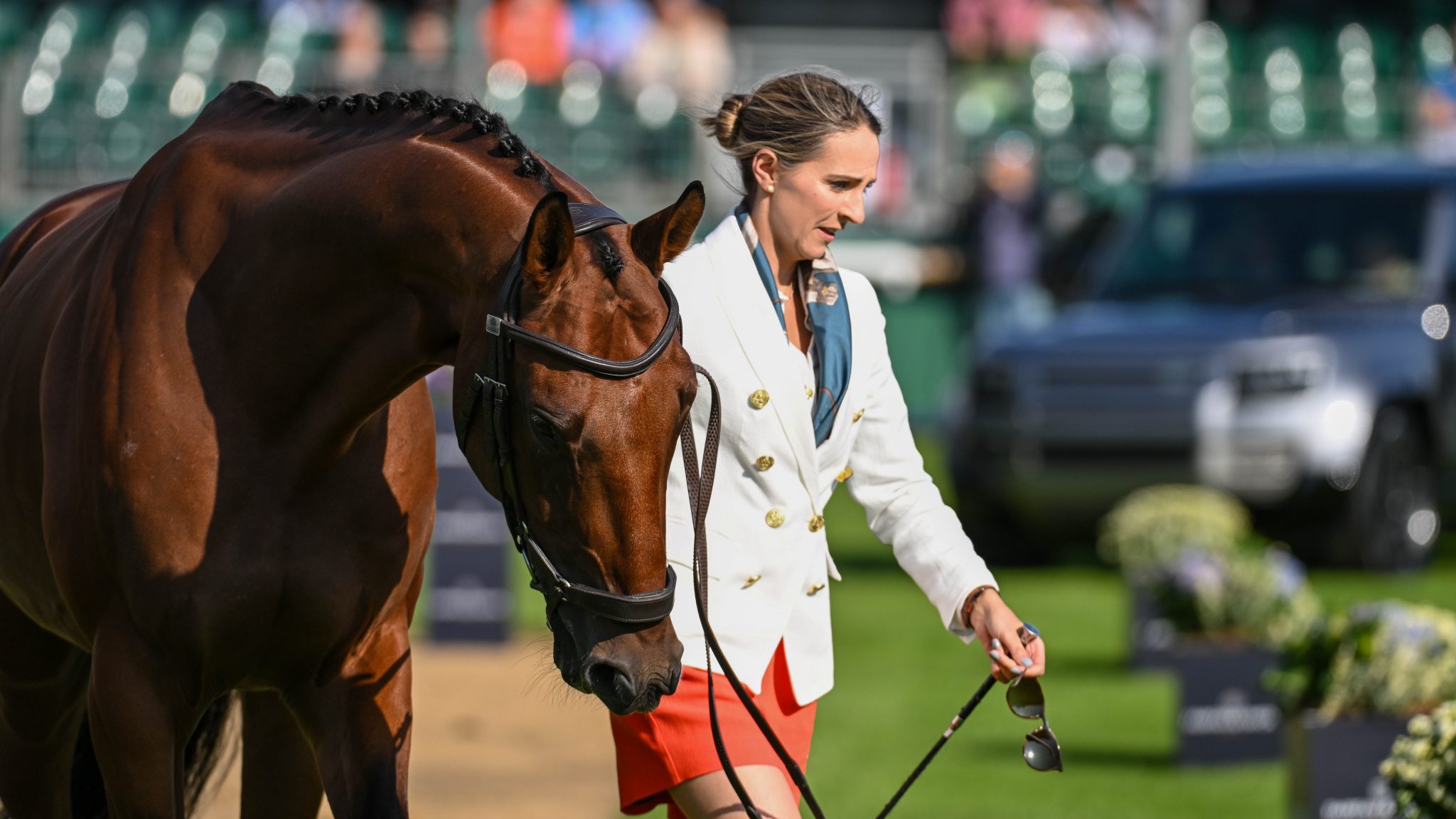 Burghley Horse Trials trot-up photos: a turquoise suit and orange shorts
