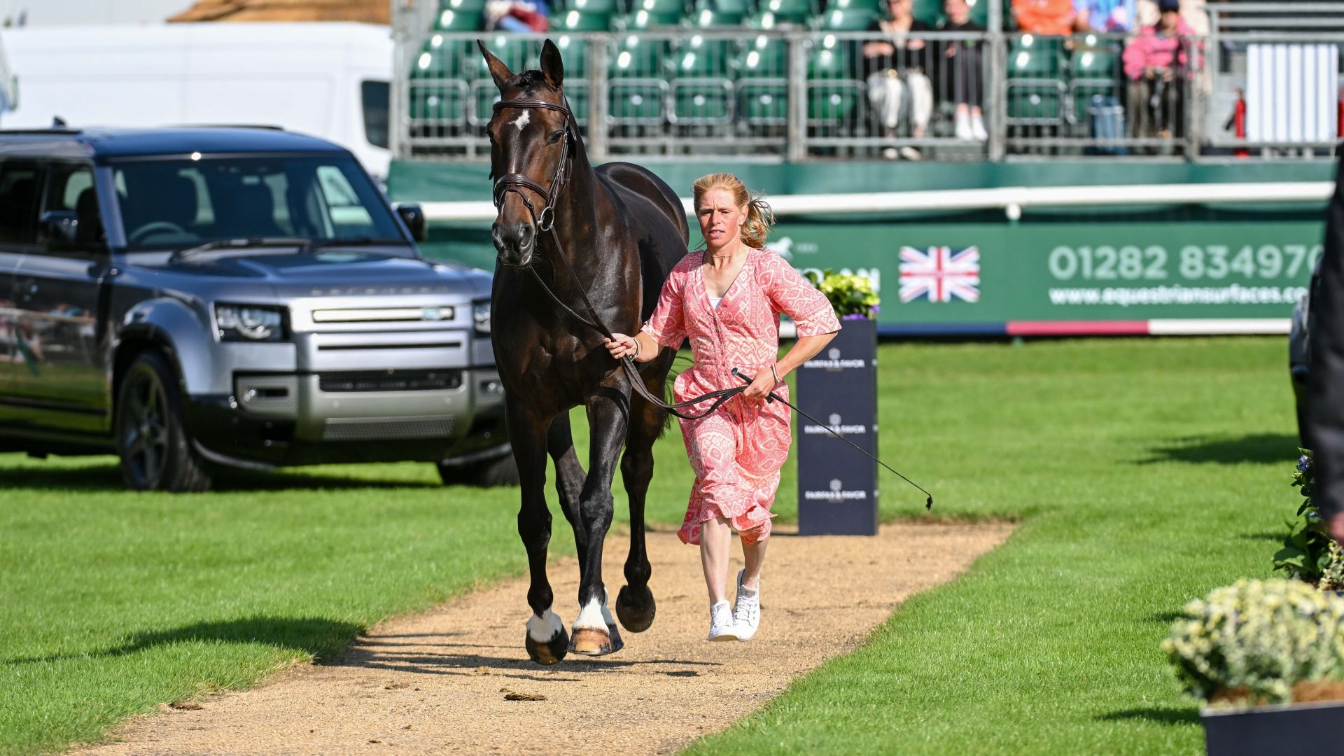 Burghley Horse Trials trot-up photos: a turquoise suit and orange shorts