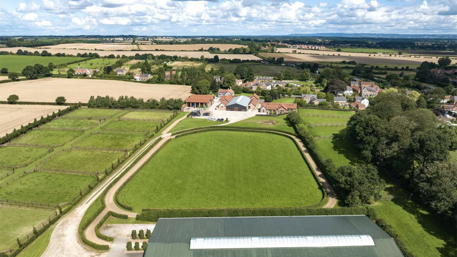 A jaw-dropping yard with three homes, indoor arena, canter track and ...