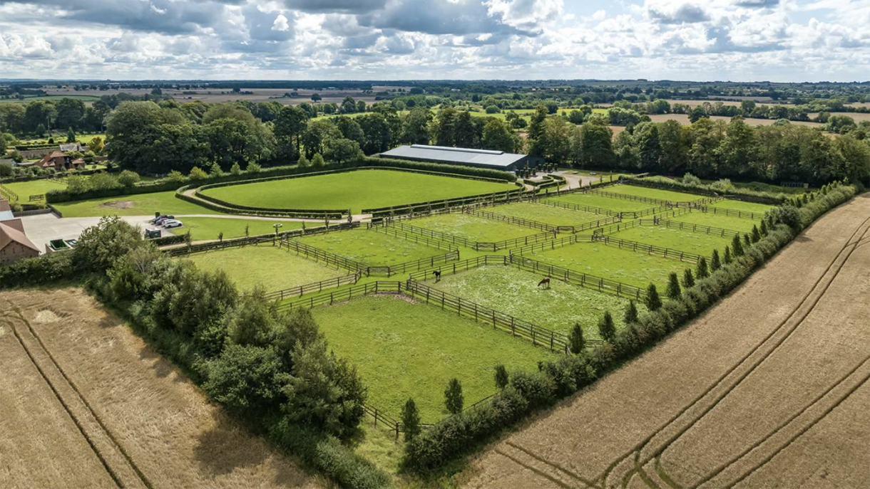 A jaw-dropping yard with three homes, indoor arena, canter track and ...