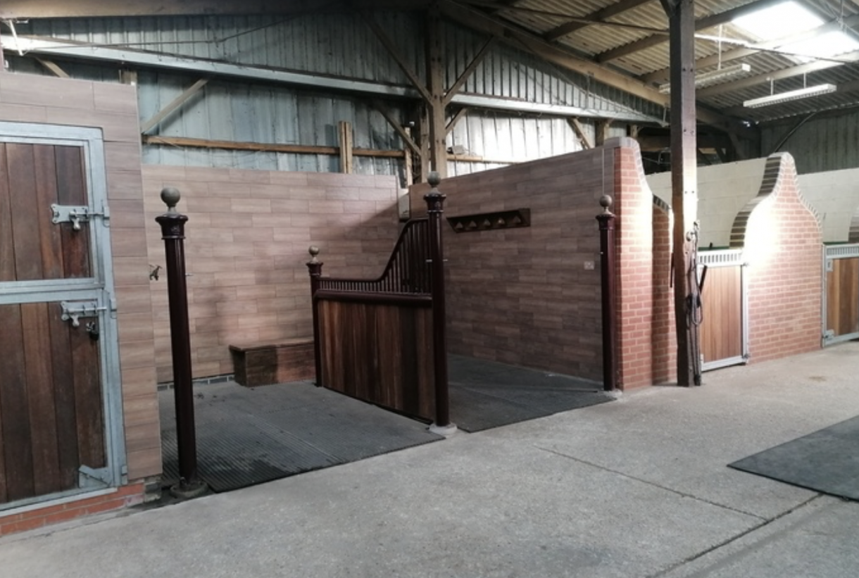 An immaculate equestrian set-up with indoor and outdoor arenas, stables ...