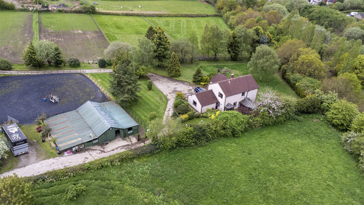 A rural home with six stables, arena, land and lovely hacking for sale