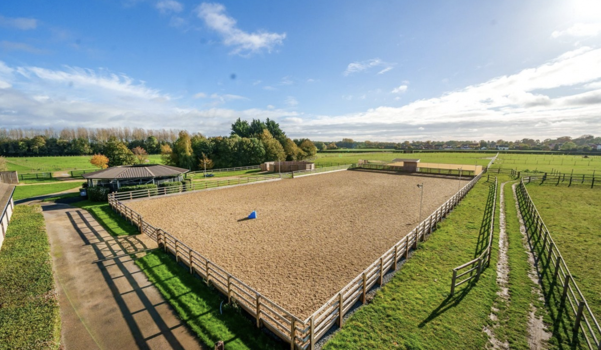 A horsey haven: plenty of stables, an arena, lunge pen, horsewalker ...