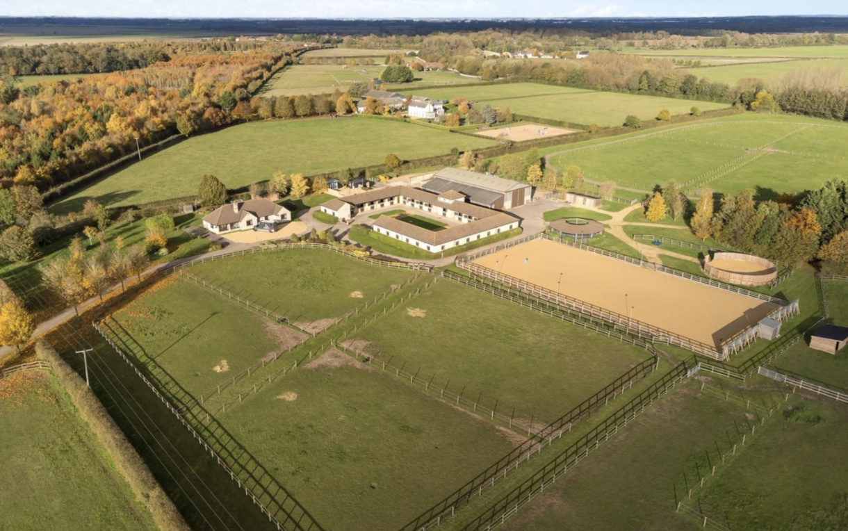 A horsey haven: plenty of stables, an arena, lunge pen, horsewalker ...