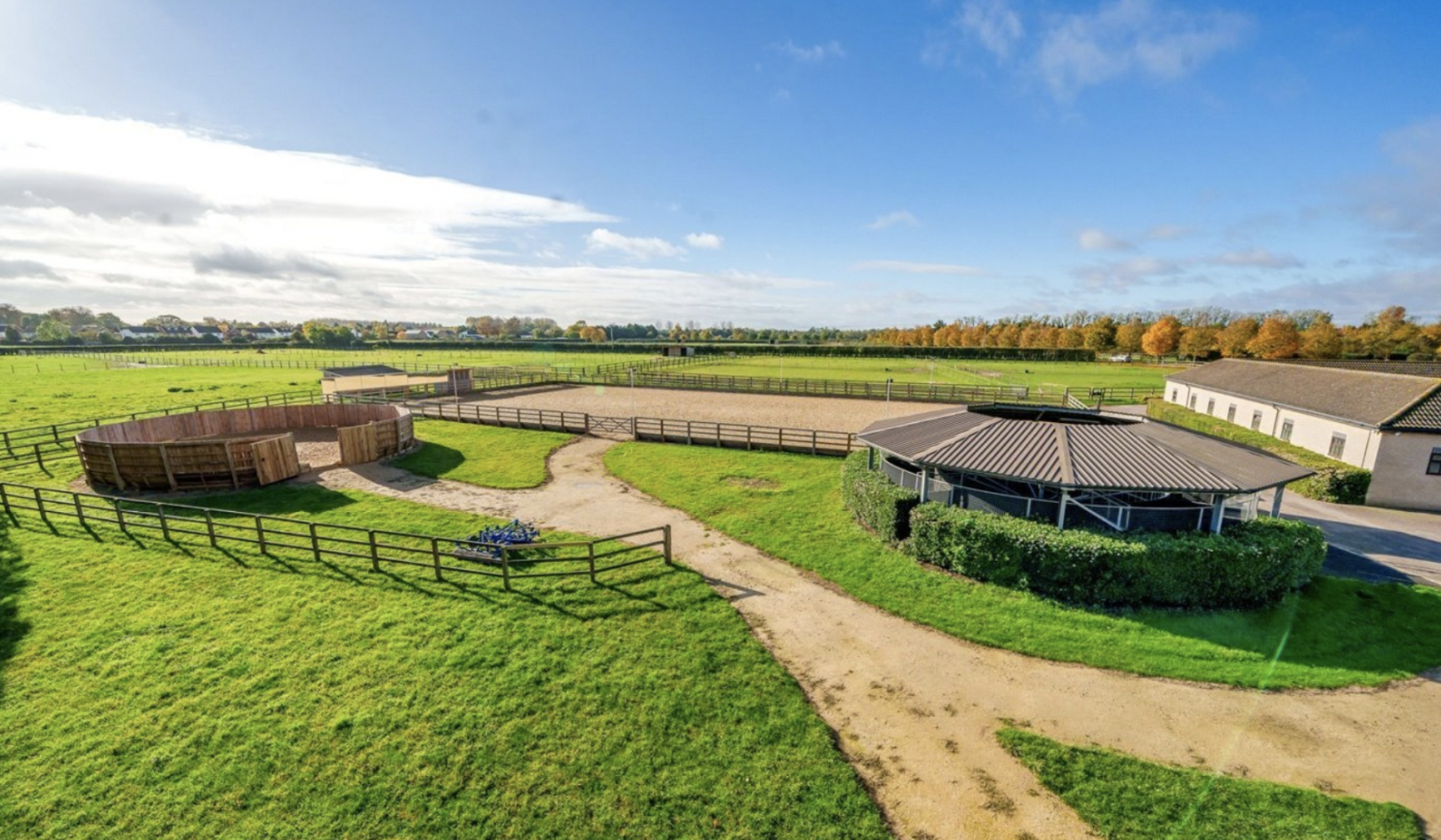 A horsey haven: plenty of stables, an arena, lunge pen, horsewalker ...