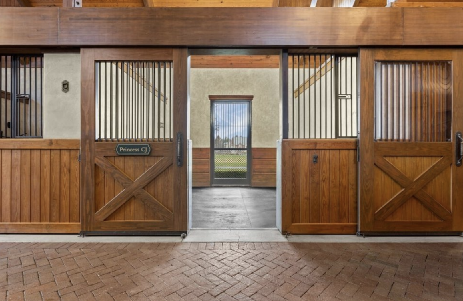 A mega equestrian home with climate-controlled stables, indoor and ...