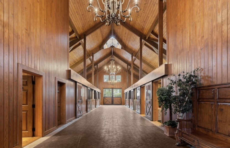 A mega equestrian home with climate-controlled stables, indoor and ...