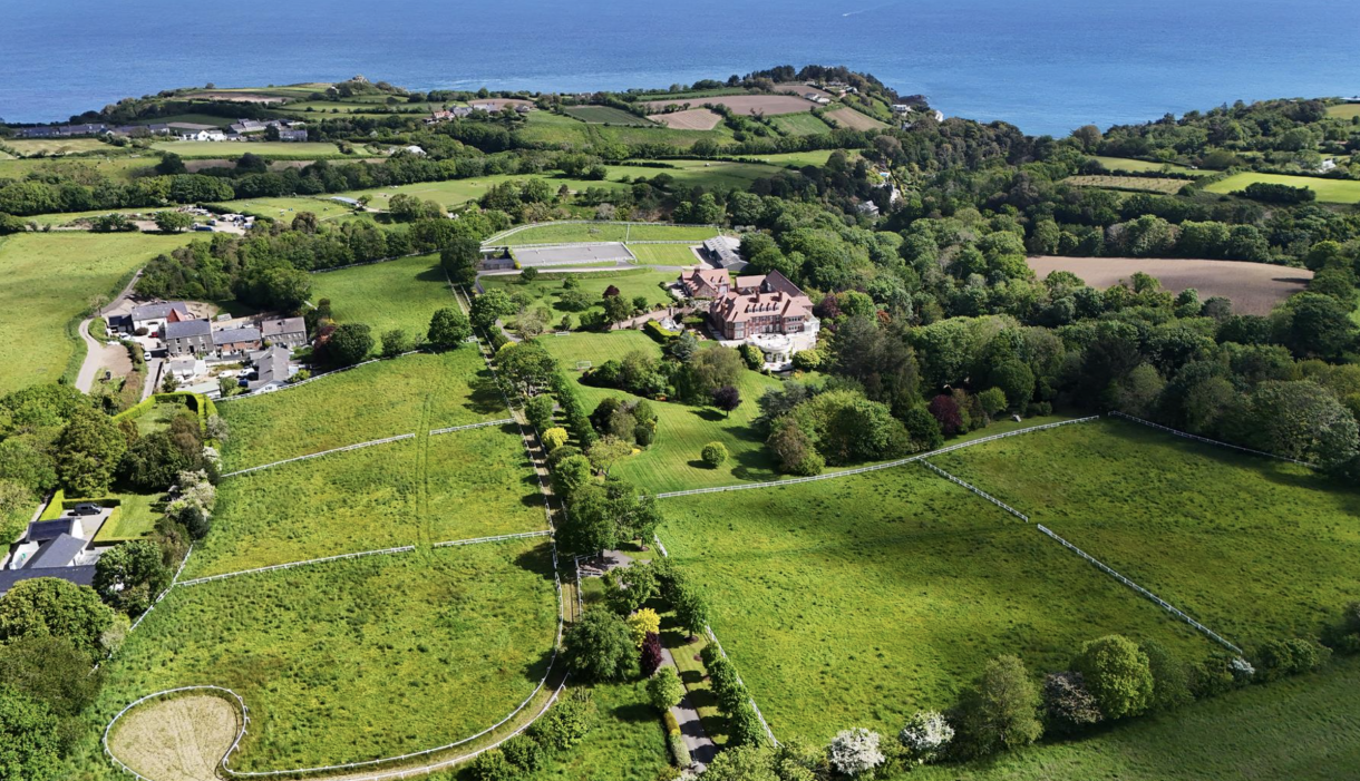 What a beauty! An impressive home with incredible views, two arenas ...