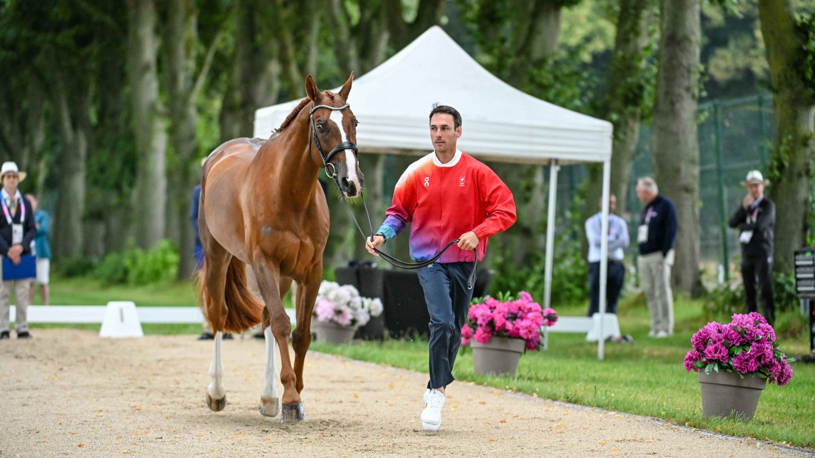 Olympic eventing first trot-up photos – suits, floaty dresses and coral ...