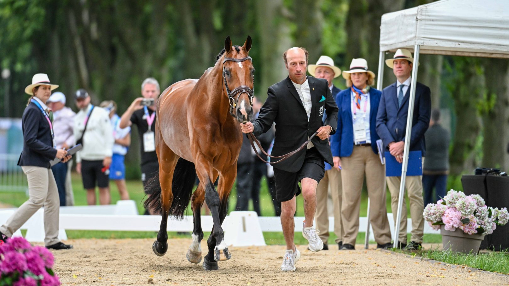 Olympic eventing first trot-up photos – suits, floaty dresses and coral ...