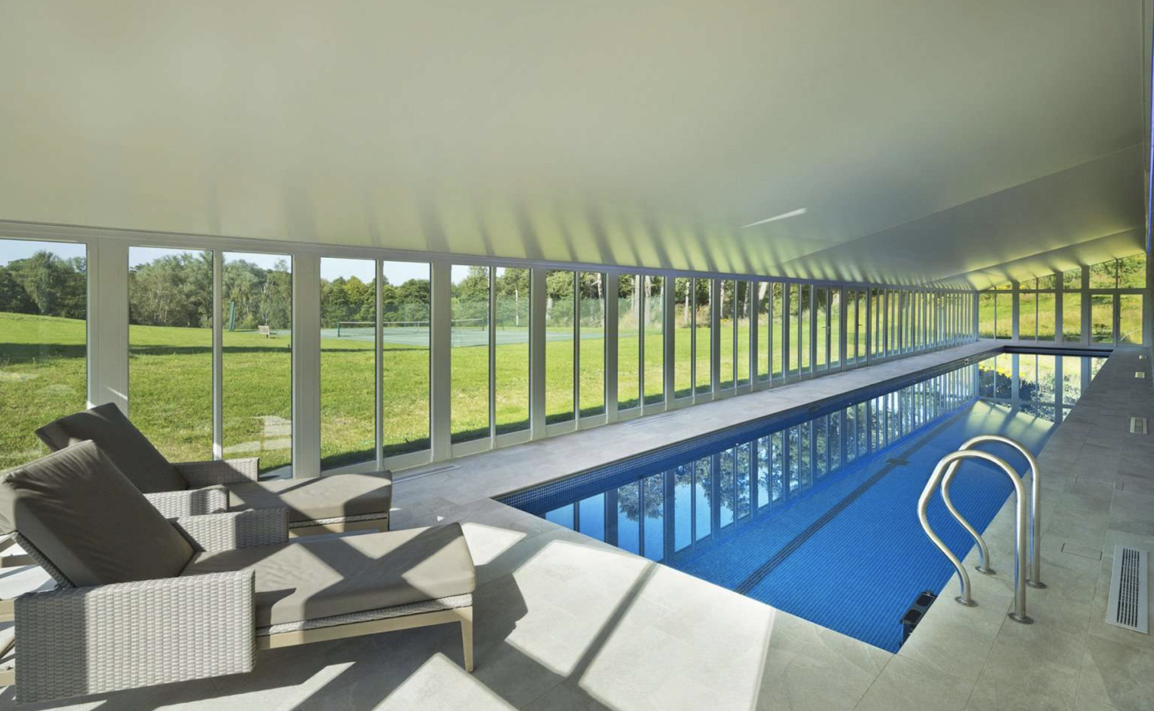 An estate of +225 acres with stables, arena, indoor pool, tennis court ...