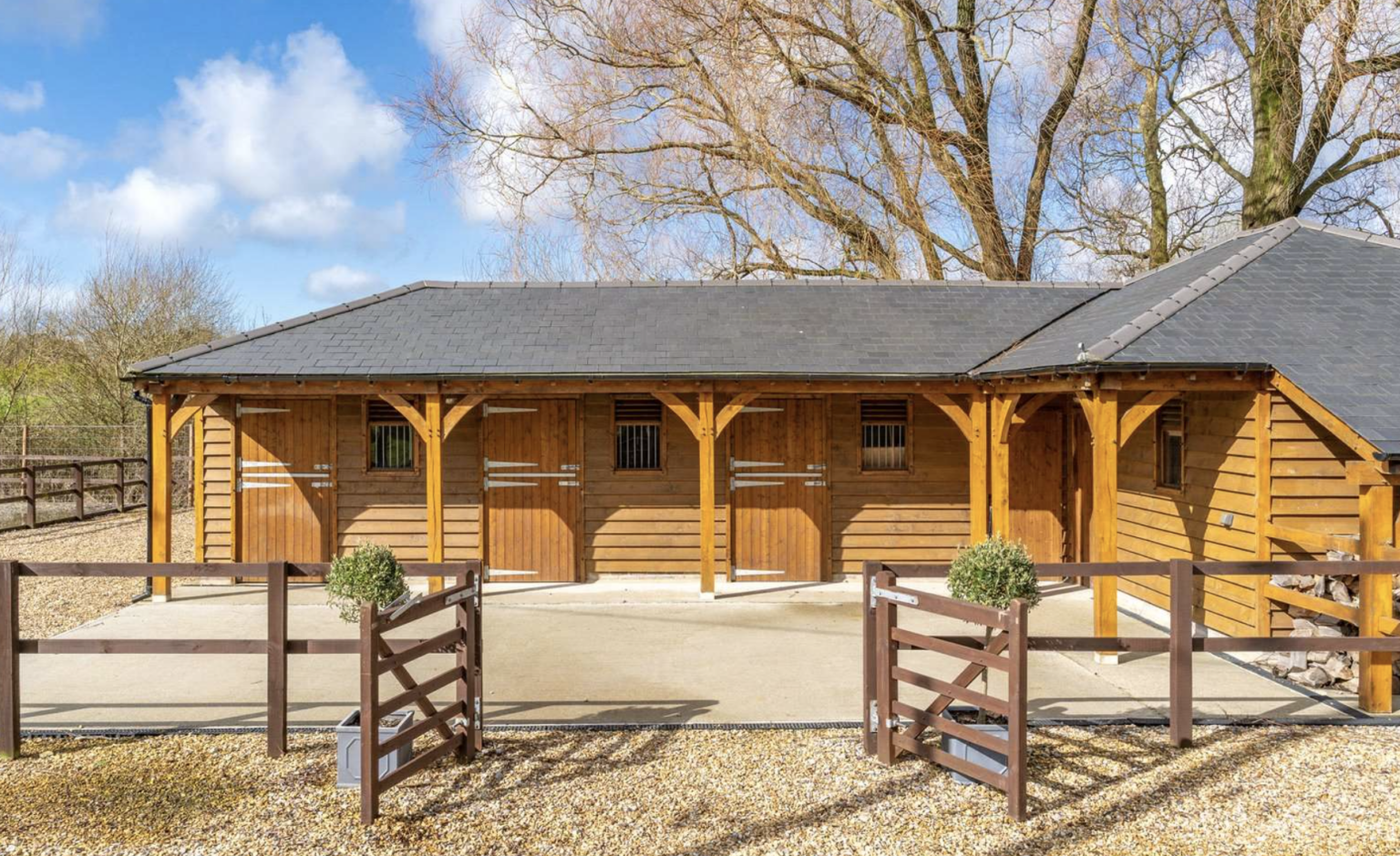 A farmhouse steeped in history and beautifully updated with stables ...