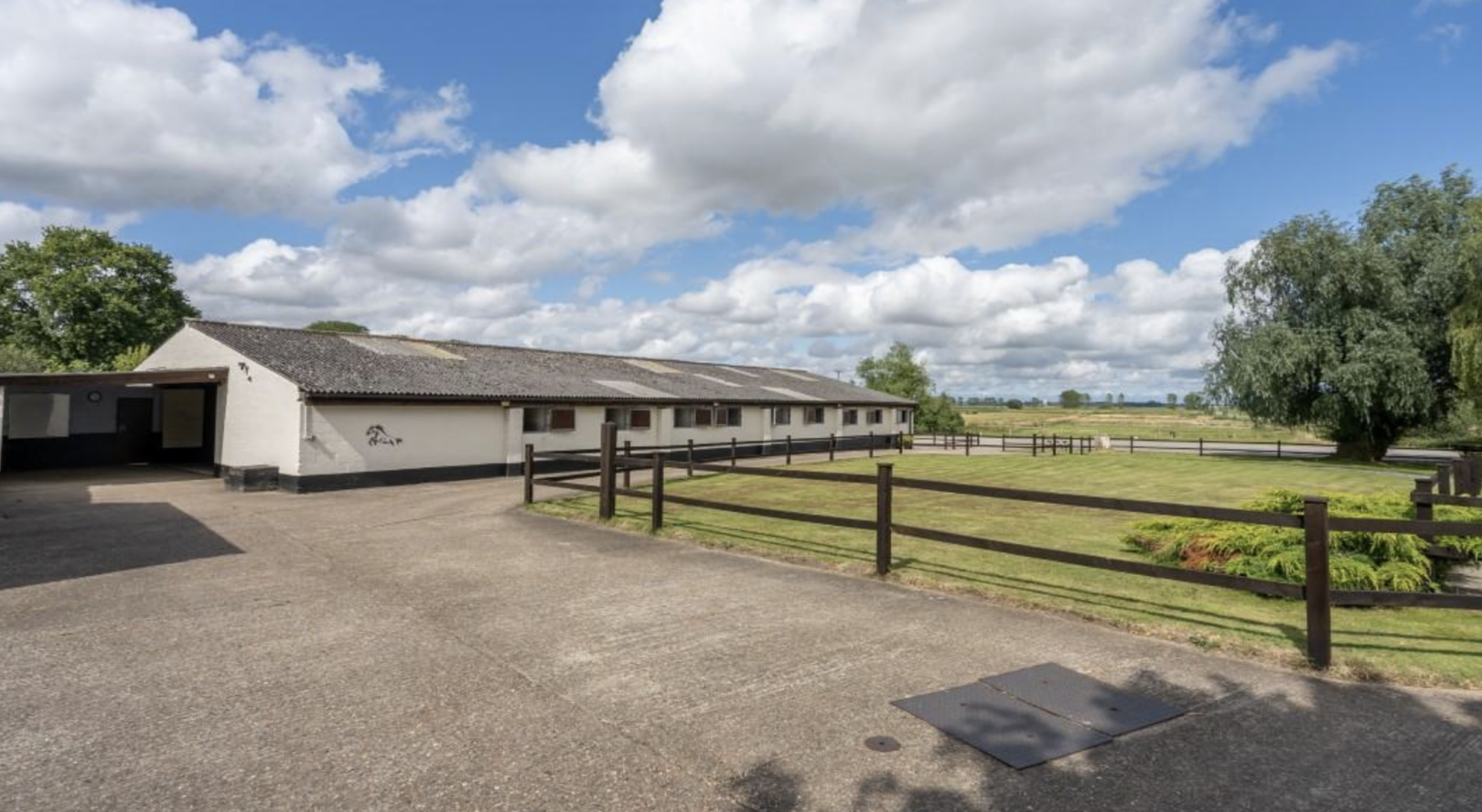 Check out this 4-bed former farmhouse with 18 acres, 17 stables, two ...