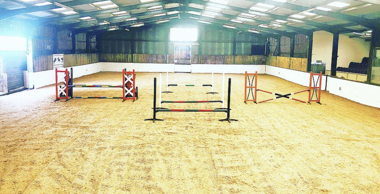 This equestrian set-up with stables, indoor and outdoor arenas, grazing ...