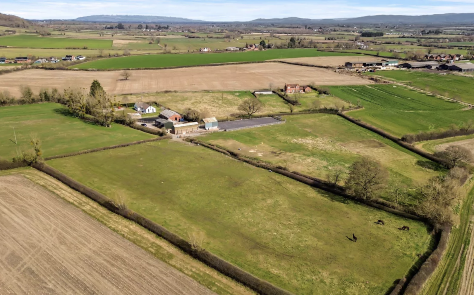 A lovely home complete with arena, stables, all-weather turnout ...