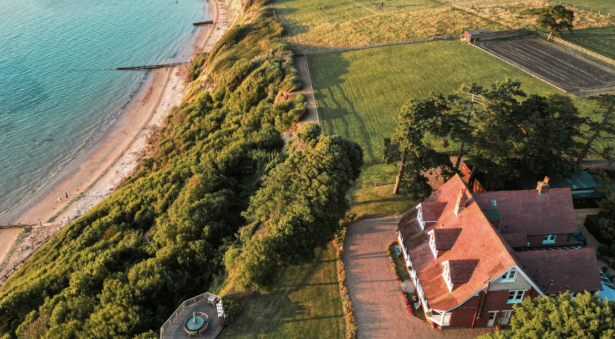 A spacious equestrian home on the coast with stables, arena and pool